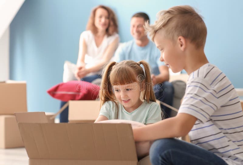 Cute Children Unpacking Box after Moving into New House Stock Image ...