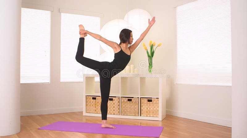 Cute Chinese Woman Doing Yoga Pose Extended Side Angle Stock Video