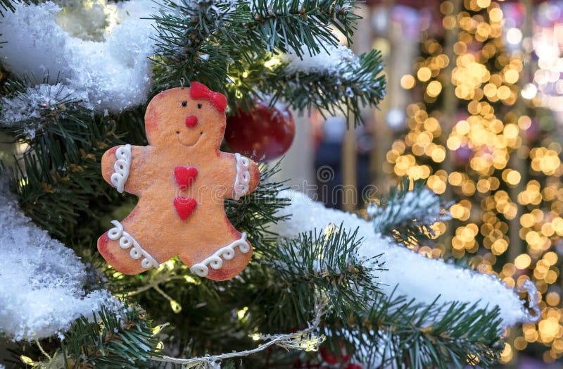 Cute Christmas Gingerbread Man on a Snow-covered Christmas Tree. Stock ...