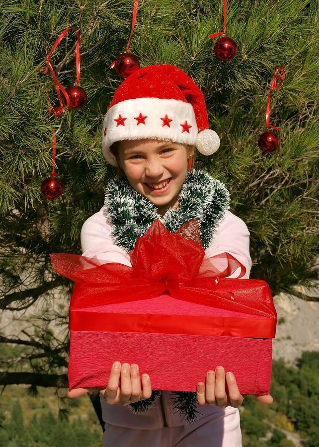 Cute Christmas Girl Giving a Gift 1 Stock Photo - Image of amaze ...