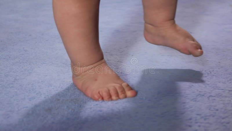 Cute Chubby Baby Feet Take First Steps on a Blue Blanket Stock Footage ...