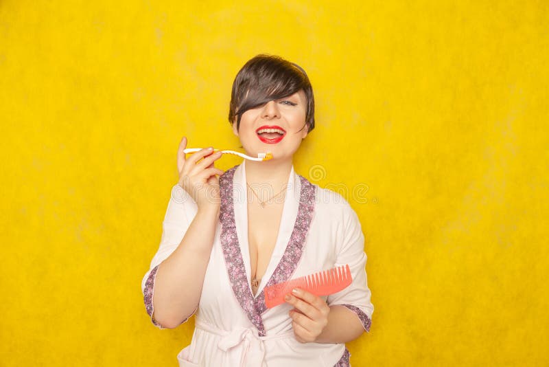 Cute Chubby Girl With Short Hair And A Curvy Figure Dressed In Beige