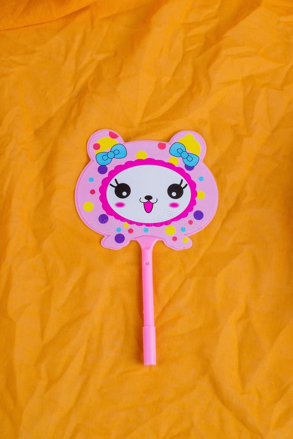 A Cute Coloured Character Hand Fan with Isolated Background Stock Image ...