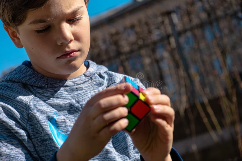 Boy Solving Rubik Cube Stock Photos - Free & Royalty-Free Stock Photos ...