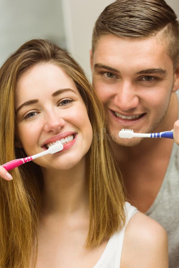 Couple Brushing Their Teeth Stock Photo - Image of mirror, girlfriend ...
