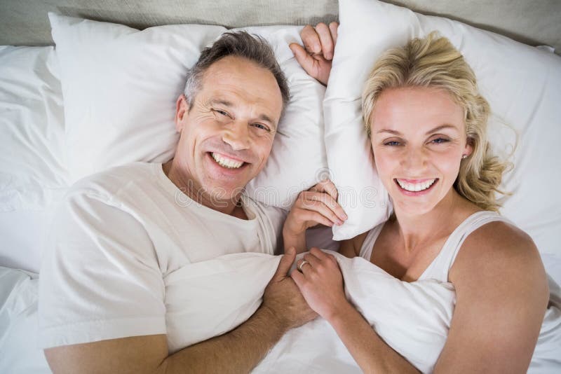Cute Couple Cuddling in Bed Stock Image - Image of calm, domestic: 66436657