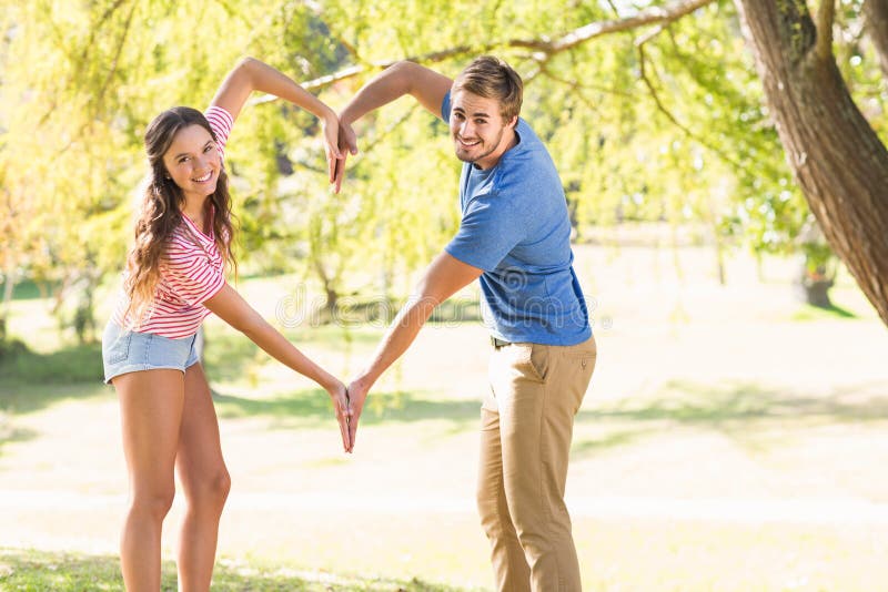 Cute Couple Doing Heart Shape with Their Hands Stock Photo - Image of ...