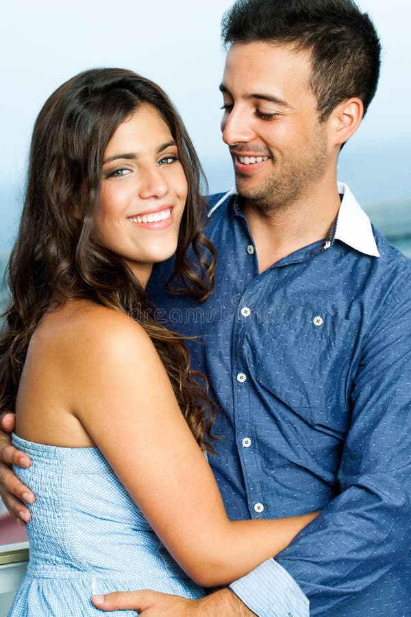 Cute Couple Socializing with Smart Phone Outdoors. Stock Image - Image ...