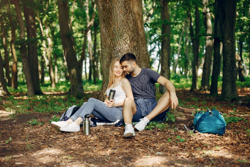 Cute Couple Have a Rest in a Summer Forest Stock Photo - Image of ...