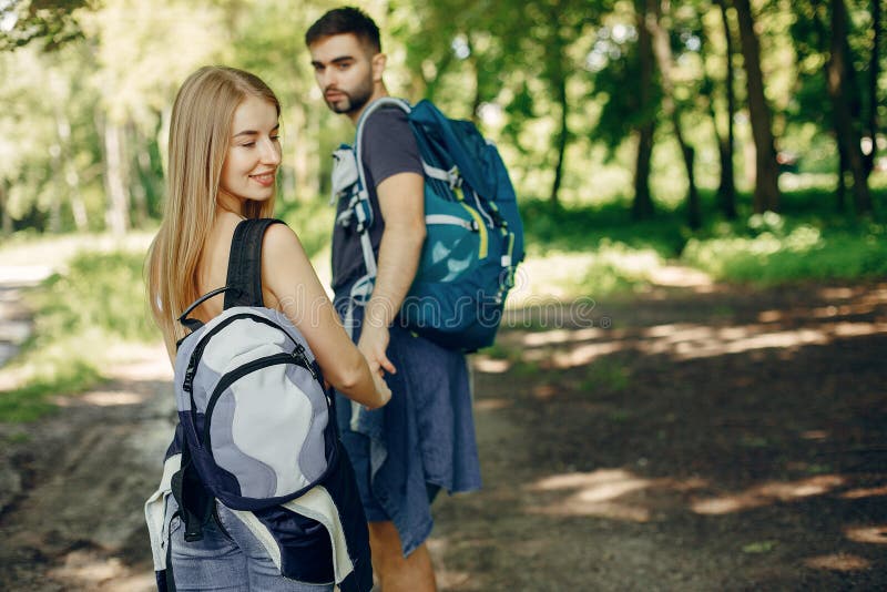 Cute Couple Have a Rest in a Summer Forest Stock Photo - Image of group ...