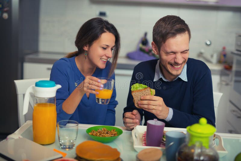 Cute Couple Having Breakfast Together at Home Stock Photo - Image of ...