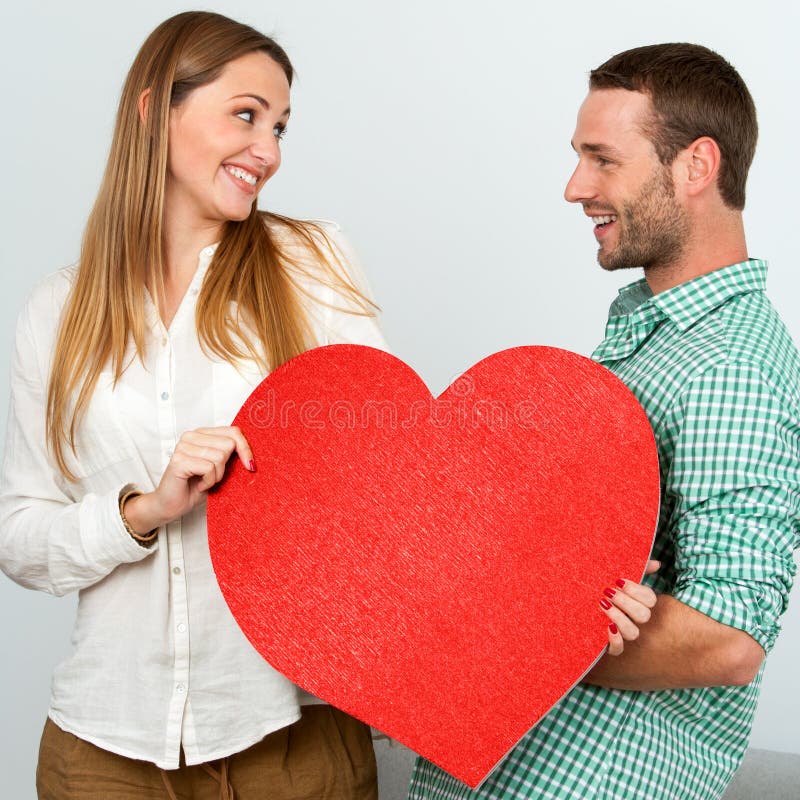 Cute Couple Holding Big Red Heart Sign. Stock Photo - Image of lovers ...