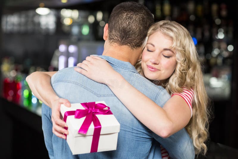 Cute Couple Hugging Having a Gift Stock Photo - Image of celebrating ...