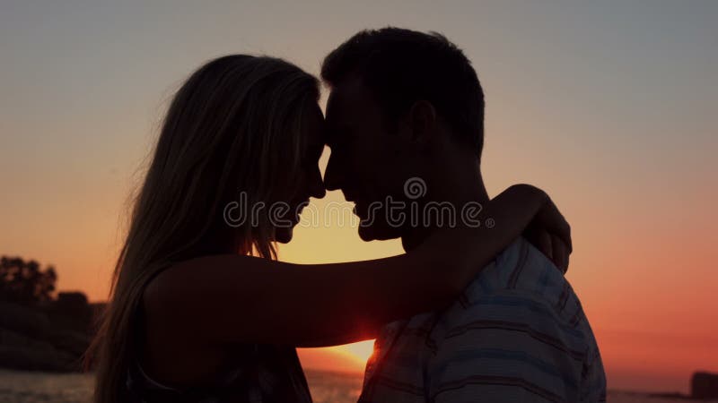 Cute Couple Hugging during the Sunset on the Beach Stock Footage ...