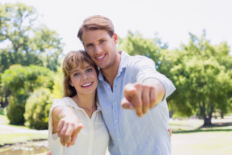 Cute Couple Pointing To the Camera in the Park Stock Image - Image of ...