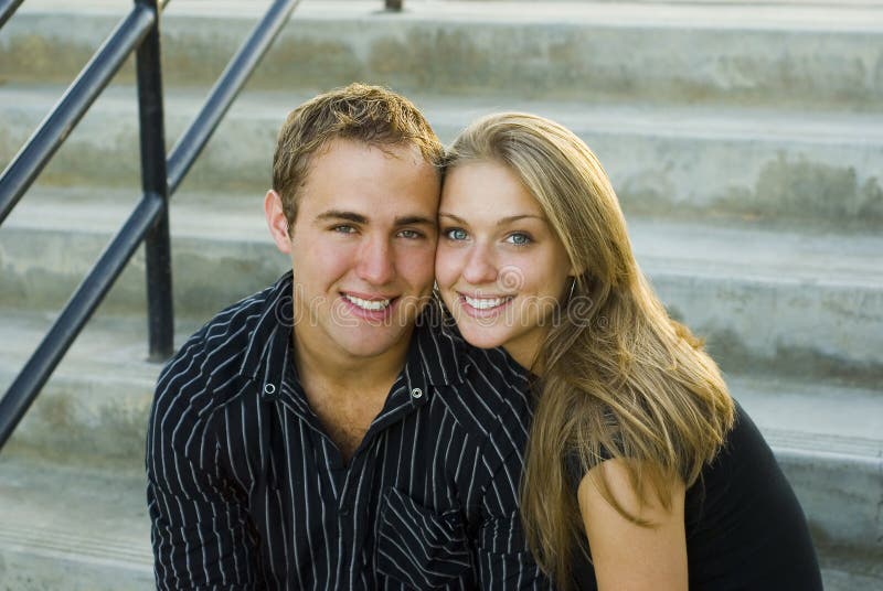 Cute Couple on the Stairs stock photo. Image of grass - 6476900