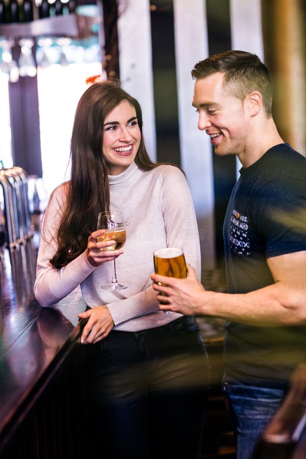 Cute Couple Talking in a Bar Stock Image - Image of food, alcohol: 66142699
