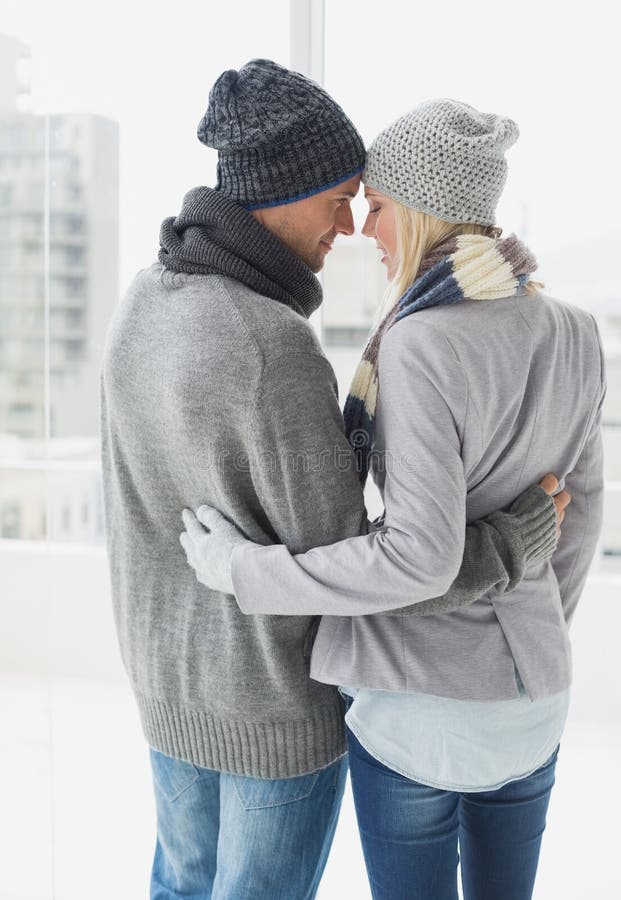 Cute Couple in Warm Clothing Hugging Stock Photo - Image of three ...