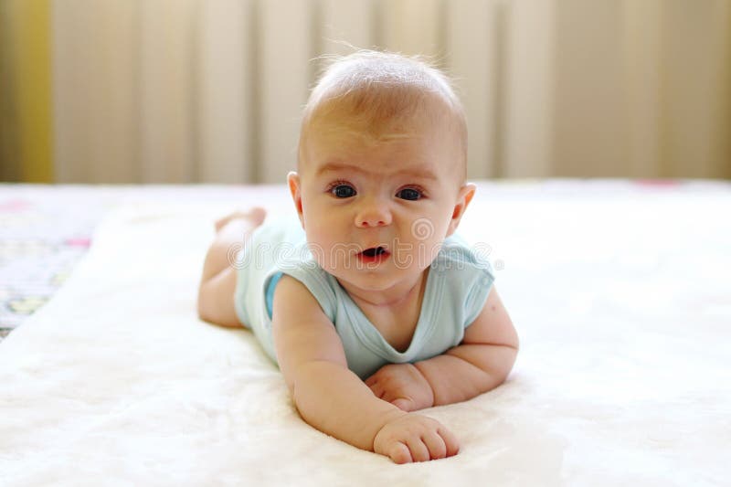 Cute Crawling Baby Girl on a Bed at Home Stock Image - Image of nappy ...