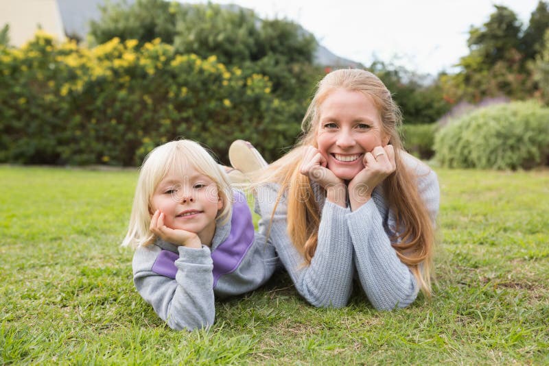 Cute Daughter and Mother Smiling at Camera Stock Image - Image of ...