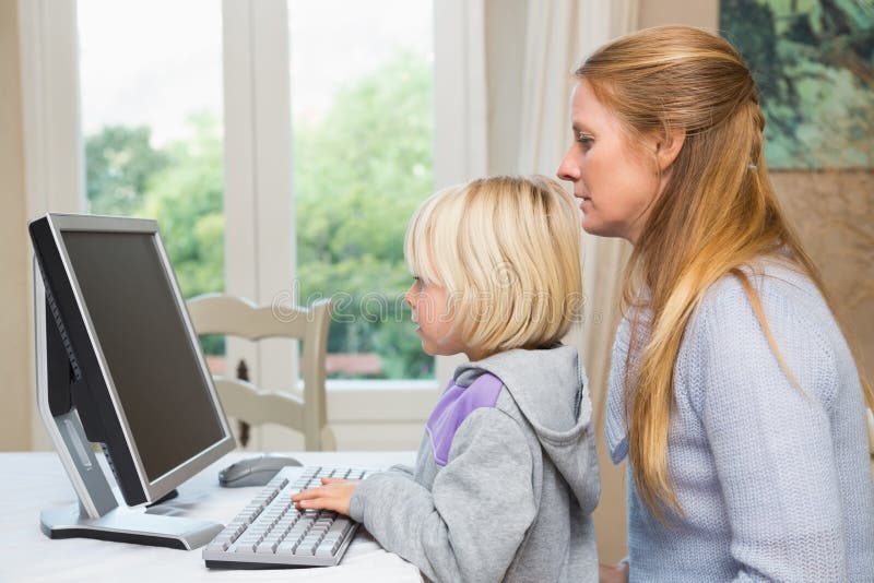 Cute Daughter and Mother Using Computer Stock Image - Image of ...