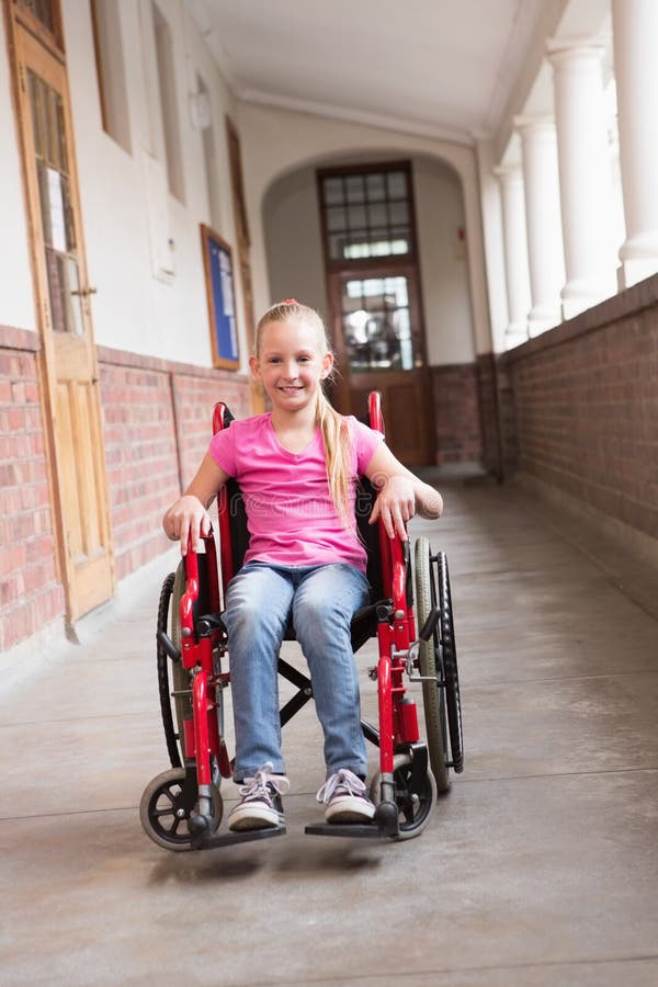 Cute Disabled Pupil Smiling at Camera in Hall Stock Photo - Image of ...