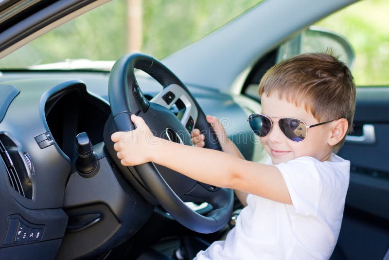 Cute driver sits in car stock image. Image of preschooler - 33450377