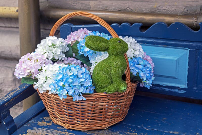 Cute Easter Bunny in a Basket with Hydrangeas Outside. Easter, Stock ...