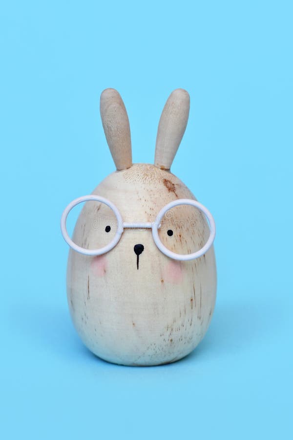 Cute Egg Shaped Easter Bunny with Glasses on Blue Background Stock ...
