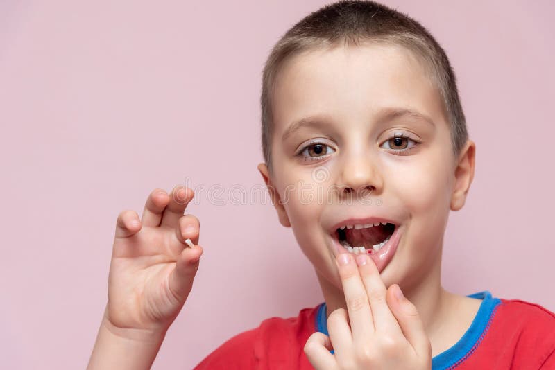 Cute Elementary Age Boy is Pulled His Baby Tooth with Hand Himself ...