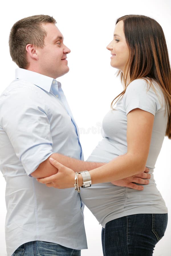 Cute Expecting Couple Posing in Studio. Stock Image - Image of laughing ...