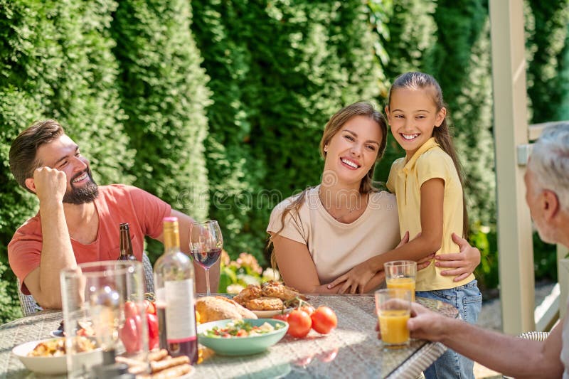 Cute Family Spending Time in the Back Yard and Looking Happy Stock ...