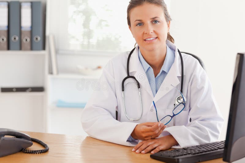 Cute Female Doctor Posing with Glasses Stock Photo - Image of ...