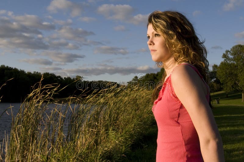 Cute Female Model Posing by a Lake Stock Photo - Image of park, glow ...