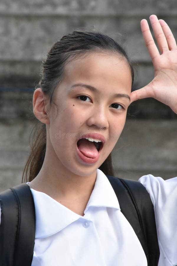 Cute Female Student Making Funny Faces with School Books Stock Image ...