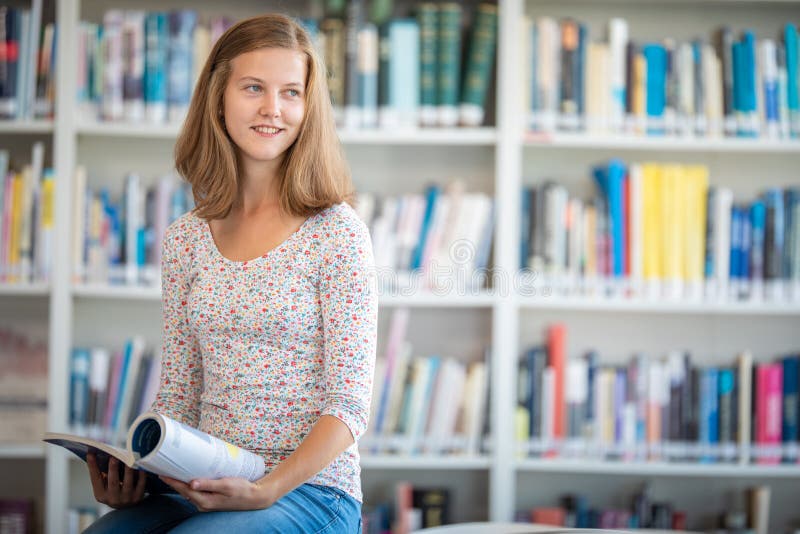 Cute Female L Student with Books in Library Stock Photo - Image of ...
