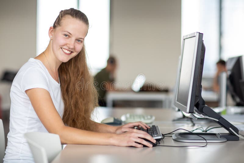 Cute Female University/highschool Student Using a Desktop Computer in a ...