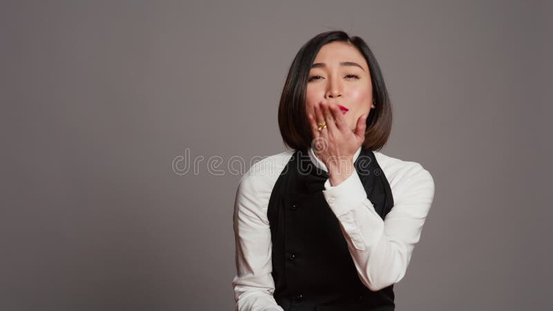 Cute Flirty Waitress Blowing Air Kisses In Front Of Camera Stock