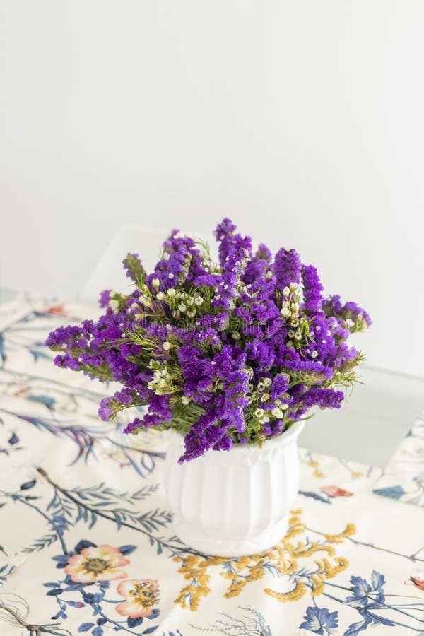 Cute Flower Arrangement with Purple Statice Decorating the Table Stock ...
