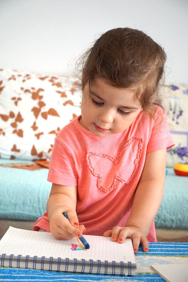 A Four-year-old Girl Learning the Skill and Art of Drawing Stock Photo ...