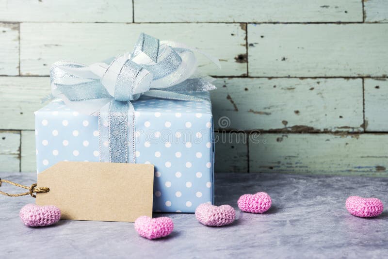 Cute Gift Box and Blank Brown Paper Tag Stock Image - Image of house ...