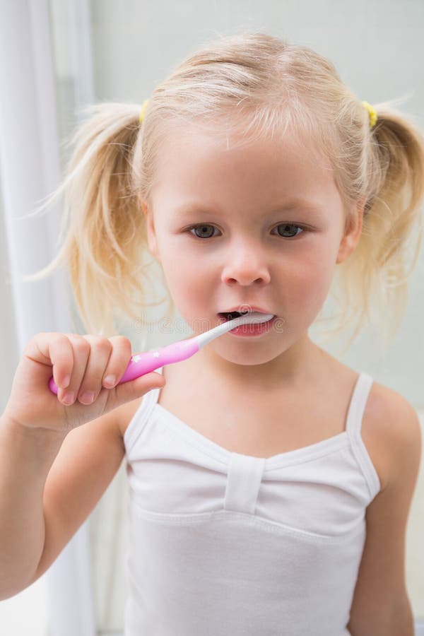 Cute Girl Brushing Her Teeth Stock Photo - Image of domicile, happy ...