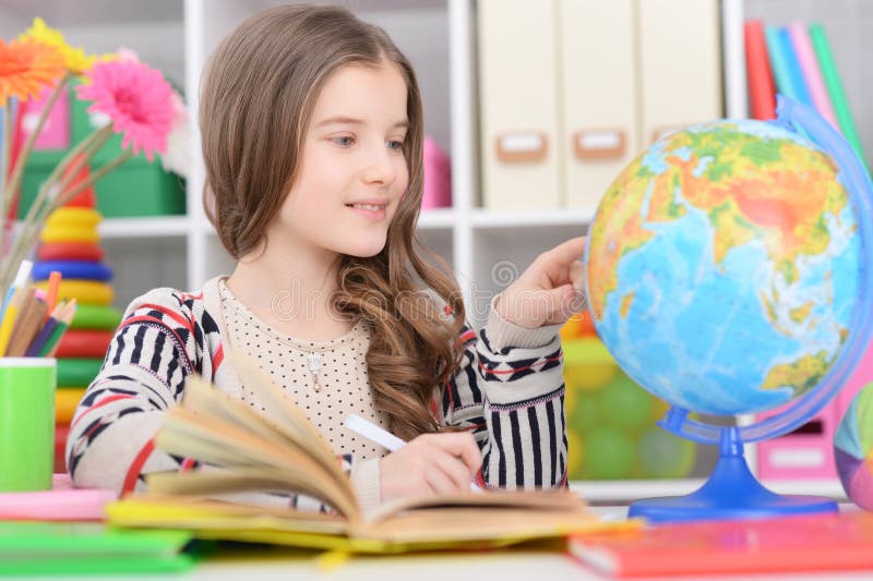 Cute girl does lessons stock image. Image of knowledge - 87871627