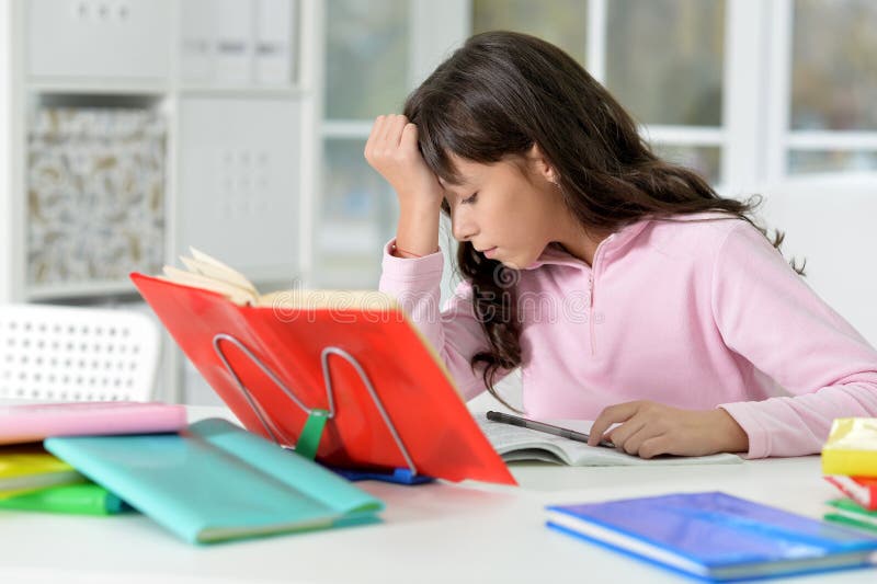 Cute girl does lessons stock image. Image of childhood - 88124907