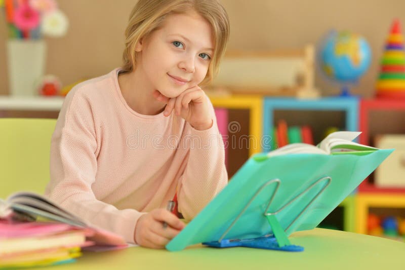 Cute girl does lessons stock image. Image of education - 89007589