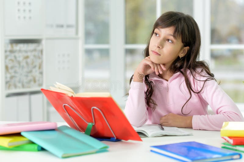 Cute girl does lessons stock image. Image of people, childhood - 91541821