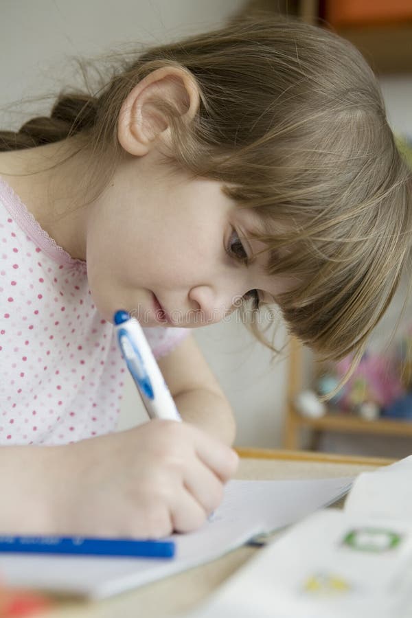 Cute girl doing homework stock image. Image of difficulty - 12540213