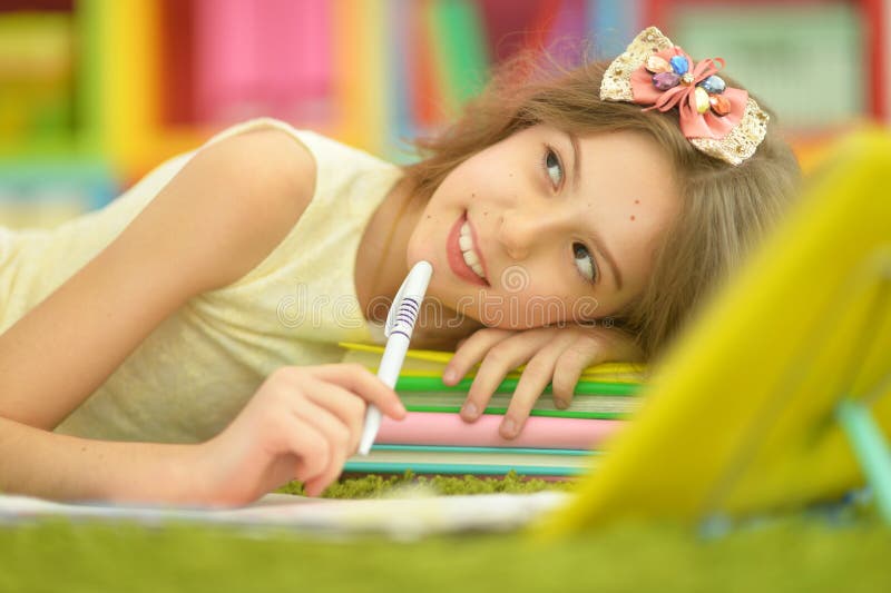 Cute girl doing homework stock image. Image of elementary - 96396273