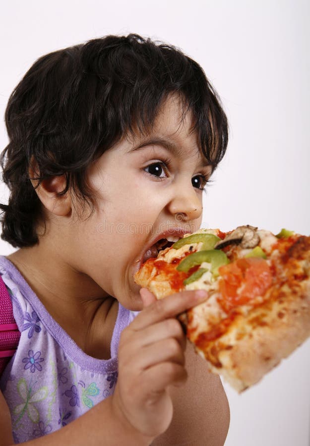 Girl eating pizza slice stock photo. Image of green, oven - 8331848