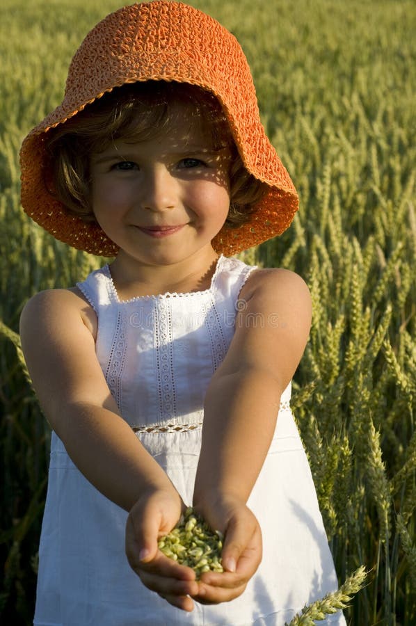 Cute girl on field stock photo. Image of hands, leisure - 5671716